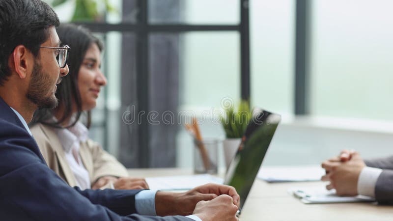 Human Resources Team Sitting in a Row at Table in Office Stock Image ...