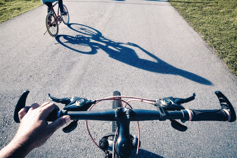 Human Riding Bicycle with Shadow on Ground Stock Photo - Image of ...