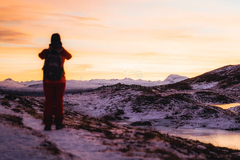 Human on the Rocky Mountains Covered with Snow, Tromso, Norway Stock ...