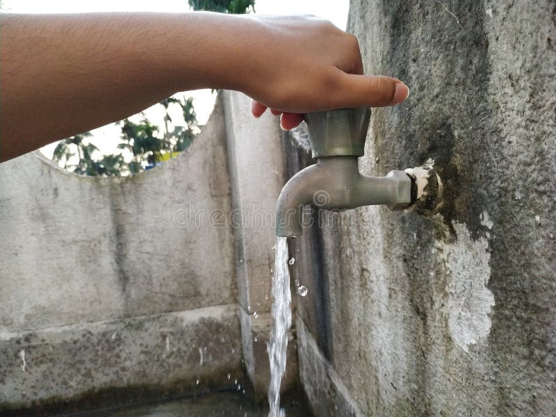 Human Save Water by Closing the Knob of Faucet Stock Photo - Image of ...