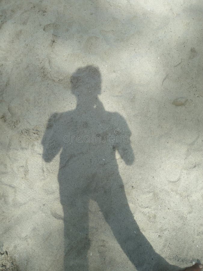 Human shadow on the sand stock photo. Image of abstract - 238861766