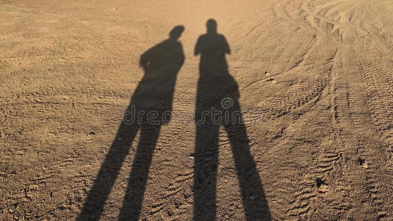 Silhouette of Two Couples Sitting Down To Watch Beach Sunset Stock ...