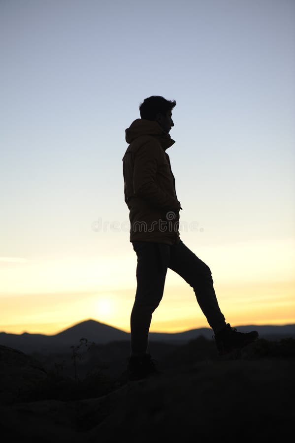 Human silhouette at sunset editorial stock image. Image of cloud ...