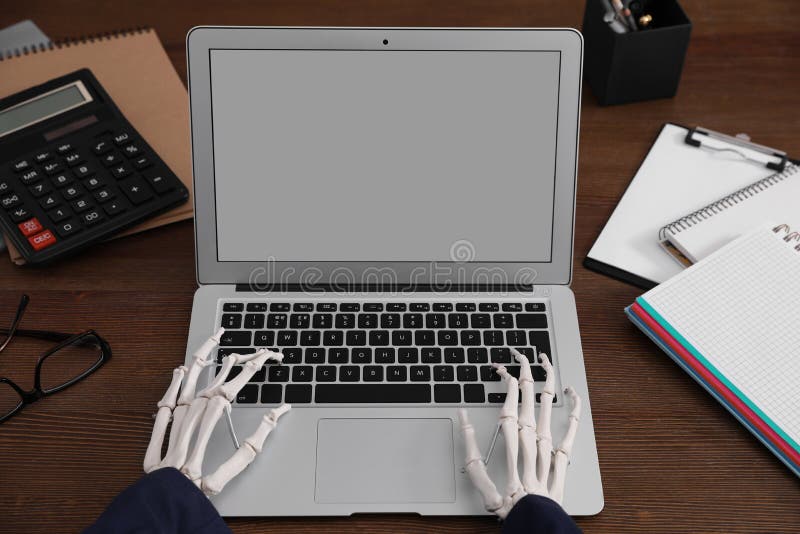 Human Skeleton in Suit Using Laptop at Table Stock Photo - Image of ...