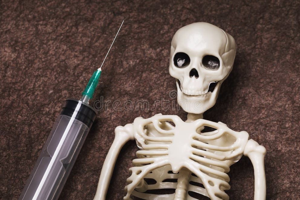 Human Skeleton and Syringe on a Stone, Top View. Lethal Injection ...