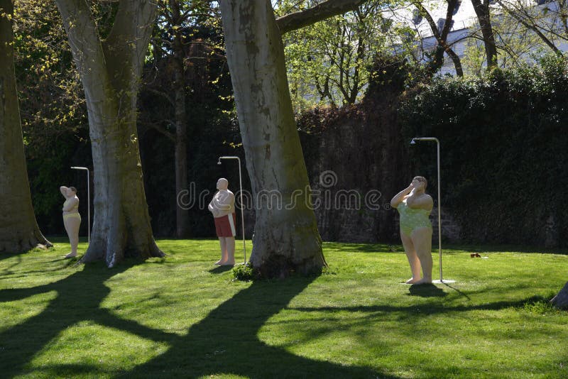 Human Statue on Bathing on the Shower in the Park Stock Photo - Image ...
