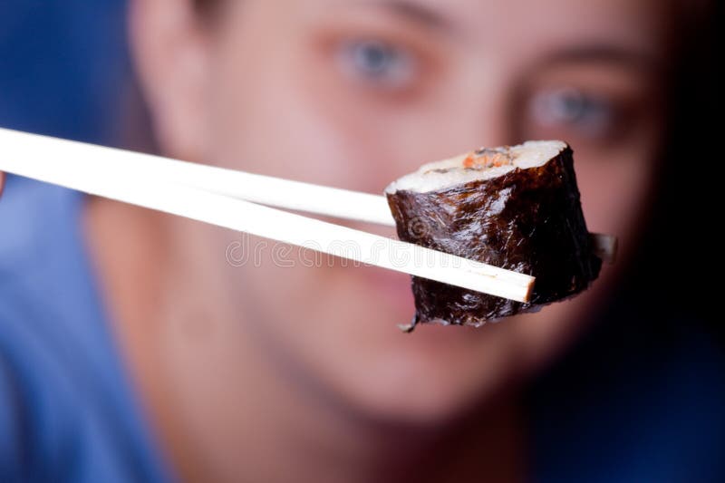 Human Take Sushi by Chopsticks Stock Photo - Image of sashimi, makisu ...