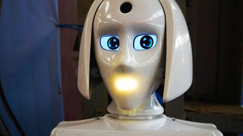 A Humanoid Robot Made of White Plastic Turns Its Eyes and Speaks ...