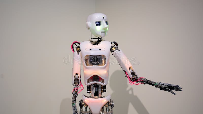 A Humanoid Robot that Performs Elementary Tasks. the Robot Moves Its ...