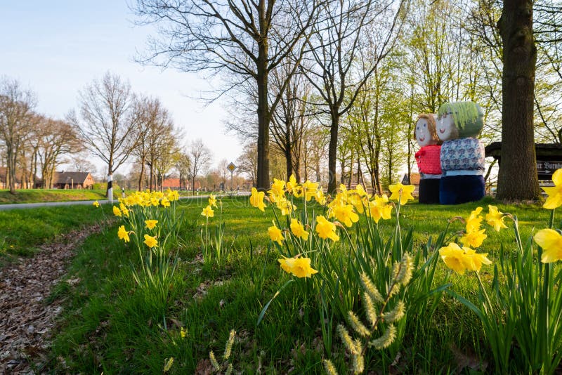 Humans from Hay Bales Stand at the Roadside Stock Image - Image of road ...