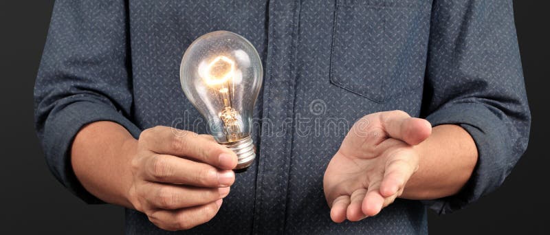 Humans Hold Light Bulbs in Hand Innovative Technology and Creativity ...