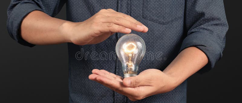 Humans Hold Light Bulbs in Hand Innovative Technology and Creativity ...