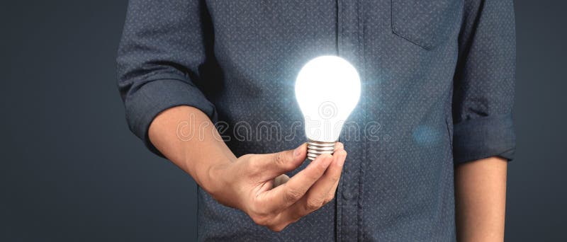 Humans Hold Light Bulbs in Hand Innovative Technology and Creativity ...