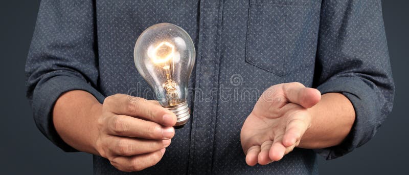 Humans Hold Light Bulbs in Hand Innovative Technology and Creativity ...