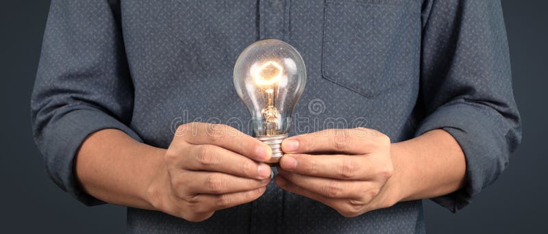 Humans Hold Light Bulbs in Hand Innovative Technology and Creativity ...
