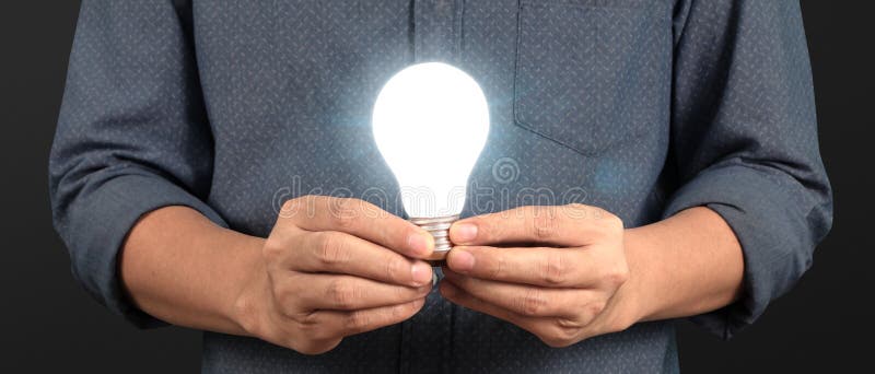 Humans Hold Light Bulbs in Hand Innovative Technology and Creativity ...