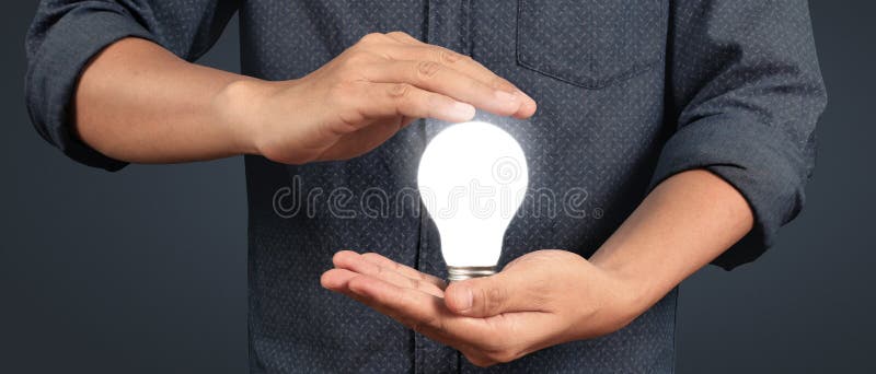 Humans Hold Light Bulbs in Hand Innovative Technology and Creativity ...