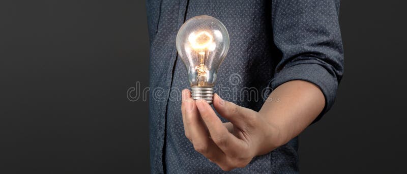 Humans Hold Light Bulbs in Hand Innovative Technology and Creativity ...