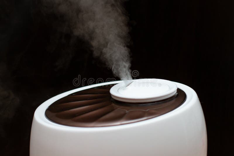 Humidifier in the House on Black Background Stock Photo - Image of ...