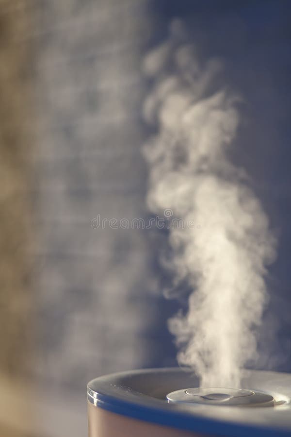 Humidifier Spreading Steam with White Brick Wall Background Stock Image ...
