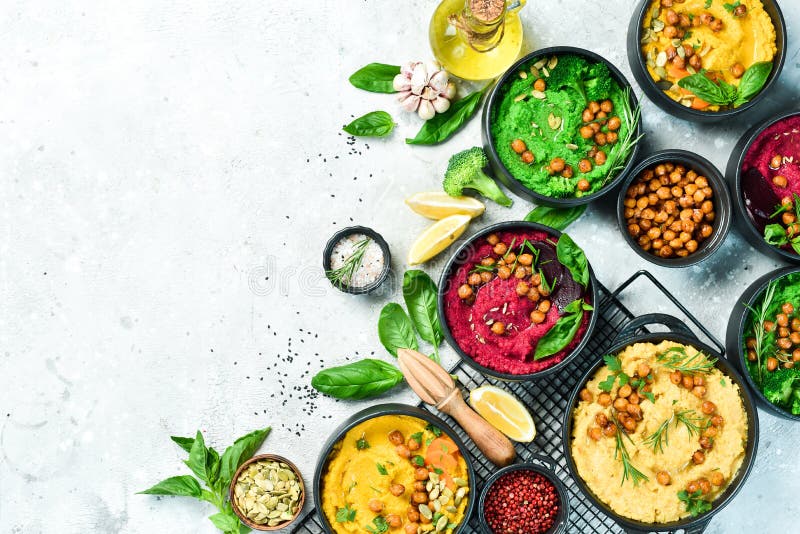 Hummus Bowls Background. Traditional Hummus, Herb Hummus, Beetroot ...