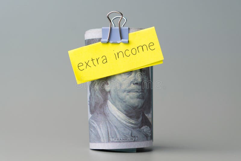 Extra Income is Shown Using the Text and Photo of Dollars Stock Image ...