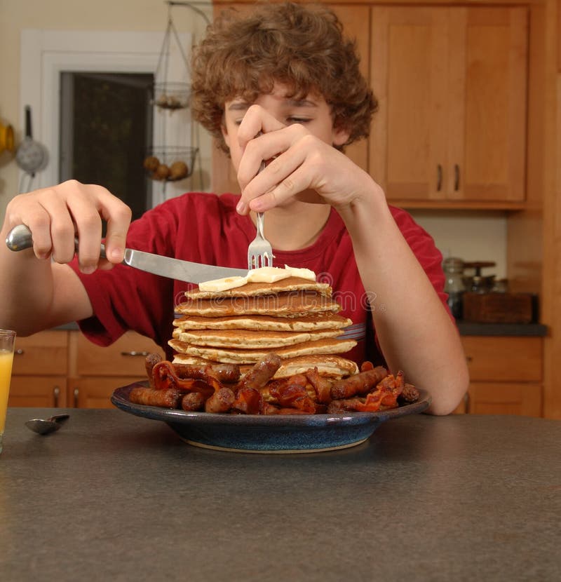Hungry boy stock photo. Image of greedy, happy, breakfast - 4760752