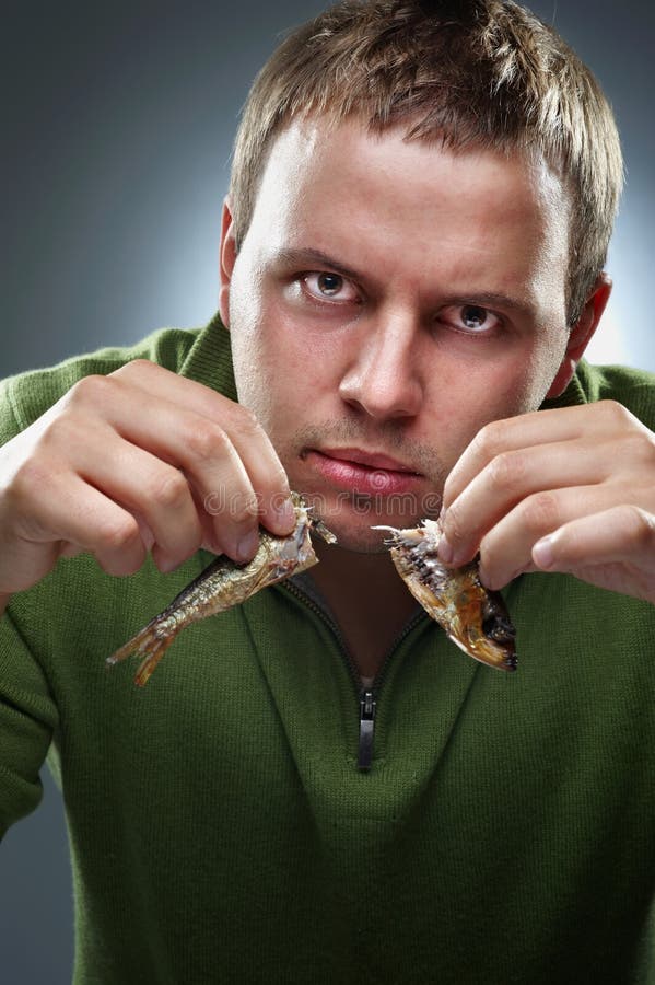 Fun Portrait of Man with Fish in Mouth Stock Image - Image of corpulent ...