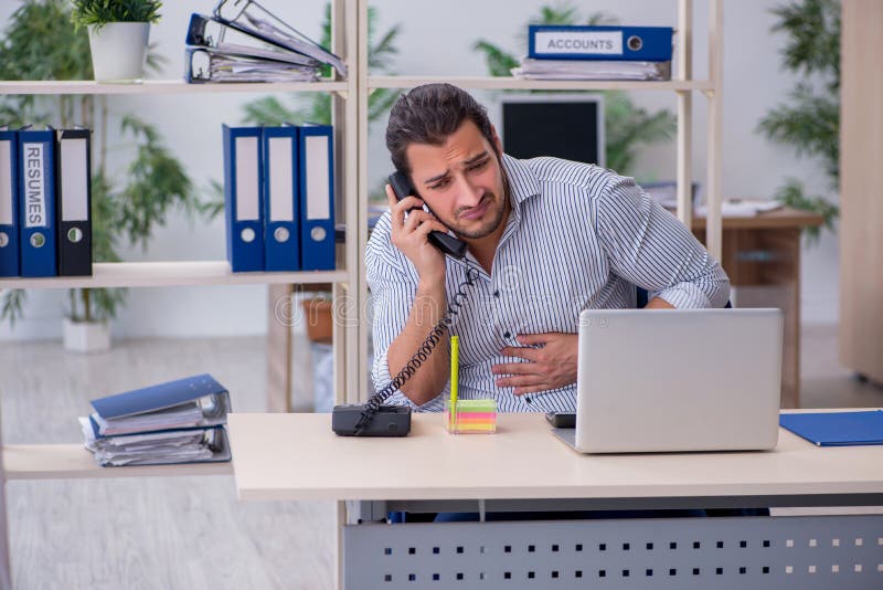 Hungry Male Employee Ordering Food at Workplace Stock Photo - Image of ...