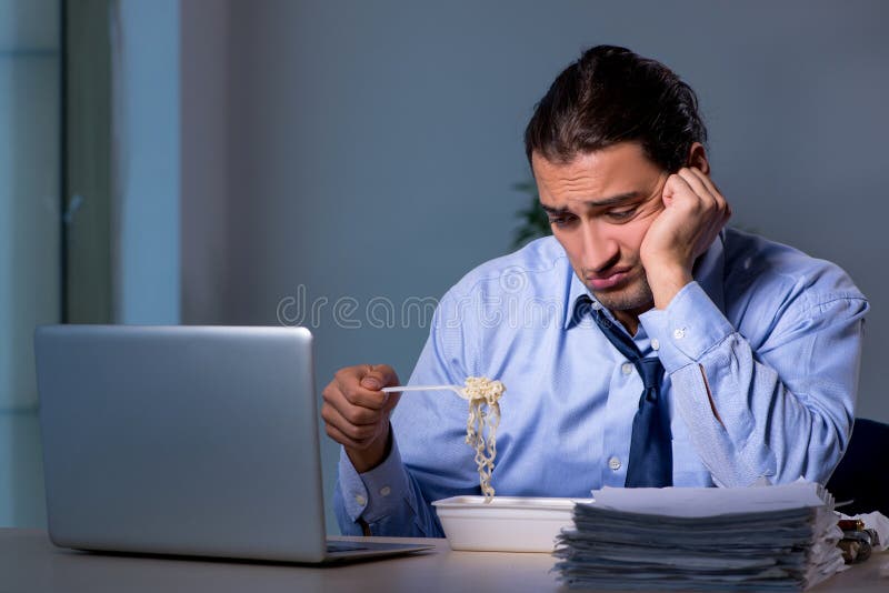 Hungry Employee Working Late in the Office Stock Image - Image of ...