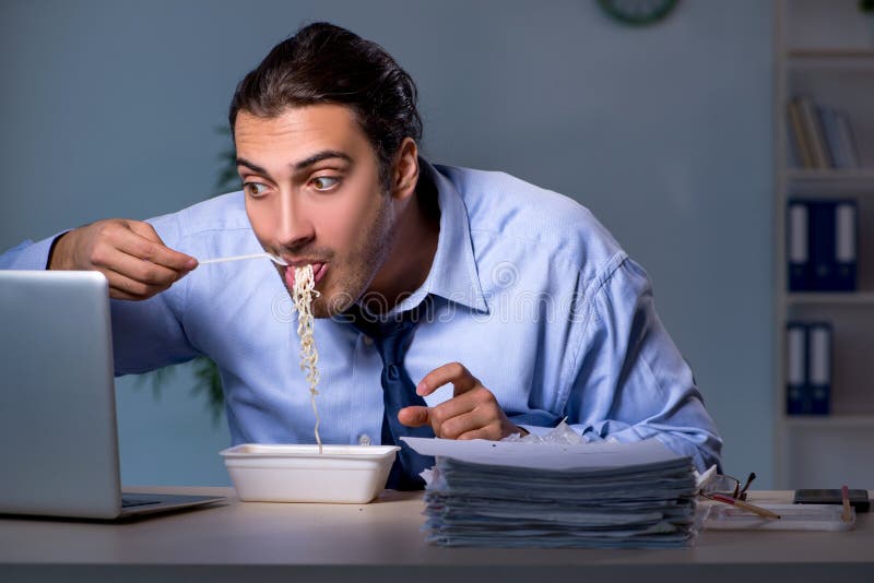 Hungry Employee Working Late in the Office Stock Image - Image of ...