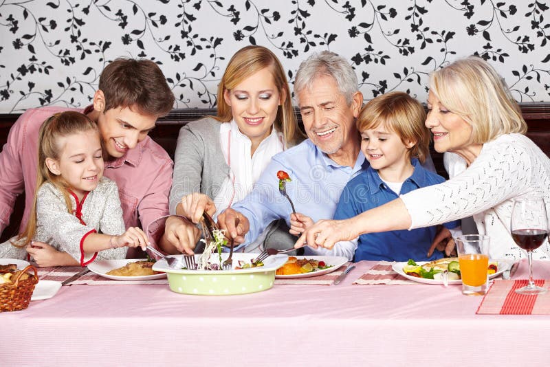 Happy Family Eating in Restaurant Stock Photo - Image of lunch, woman ...