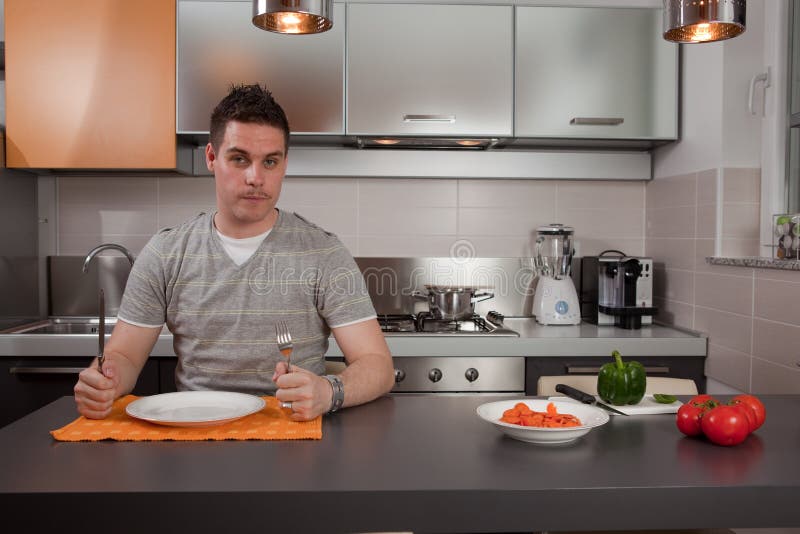 Hungry guy stock image. Image of indoors, caucasian, serious - 14221131