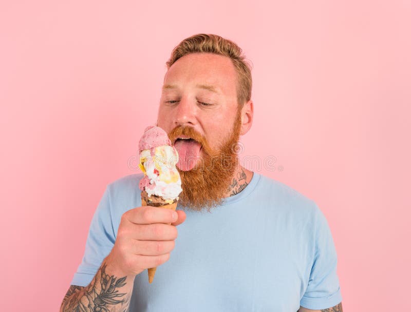 Hungry Man with Beard and Tattoos Eats a Big Icecream Stock Image ...