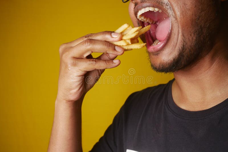 Hungry Man Eating Fries Closeup Stock Image - Image of head, smiling ...