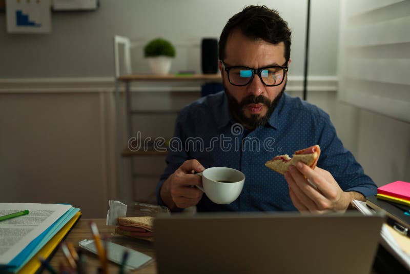 Hungry Man Having Dinner at the Office Stock Image - Image of sandwich ...