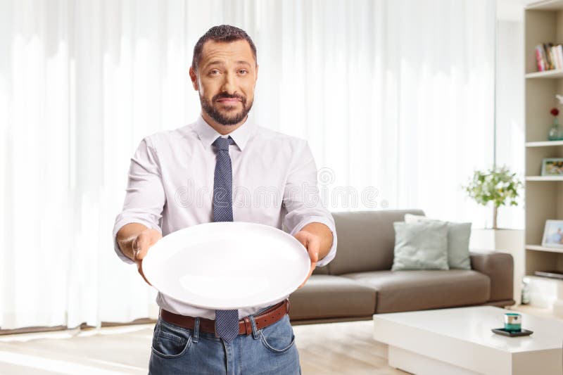 Hungry Man Holding an Empty Plate Stock Image - Image of businessman ...