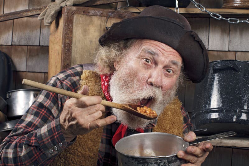 Hungry Old Cowboy Eating Beans from a Saucepan Stock Image - Image of ...