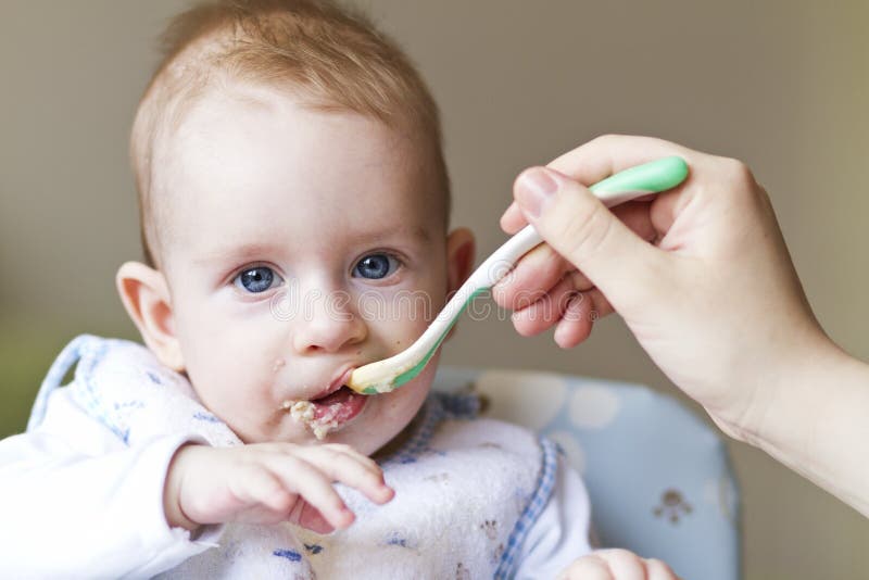 Hungry Toddler Eating Porridge Stock Image - Image of emotion, oatmeal ...