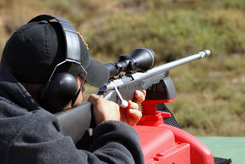 Man Shooting Rifle stock photo. Image of optic, sport - 13060052