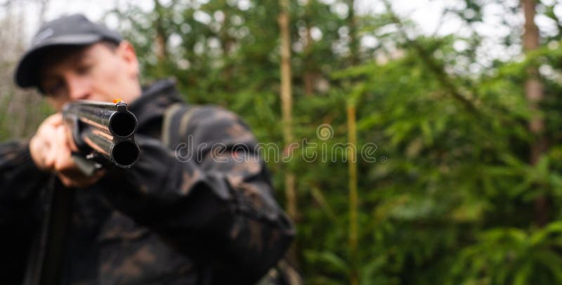 Hunter aiming a shotgun stock photo. Image of cold, camouflage - 200746400