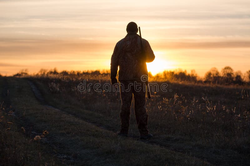 Hunter in Backlight. Hunter at Sunset. the Shadow of the Hunter Stock ...