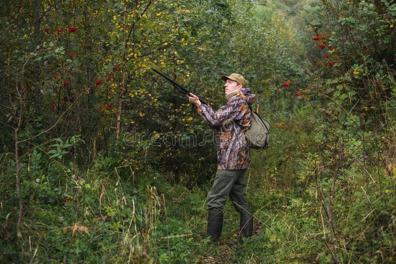 Hunter in the Autumn Forest. Stock Image - Image of hunter, aiming ...