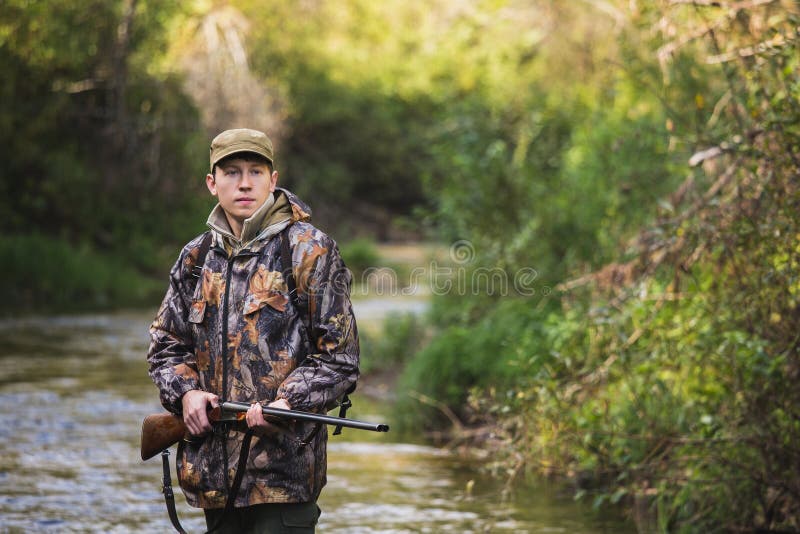 Hunter in the Autumn Forest. Stock Image - Image of hunting, looking ...