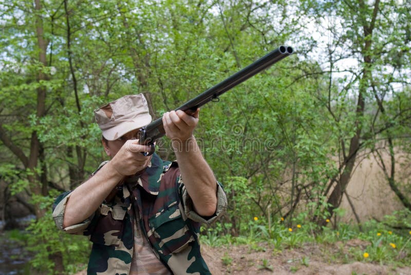 Hunter with gun in hand stock photo. Image of hunter - 14731904