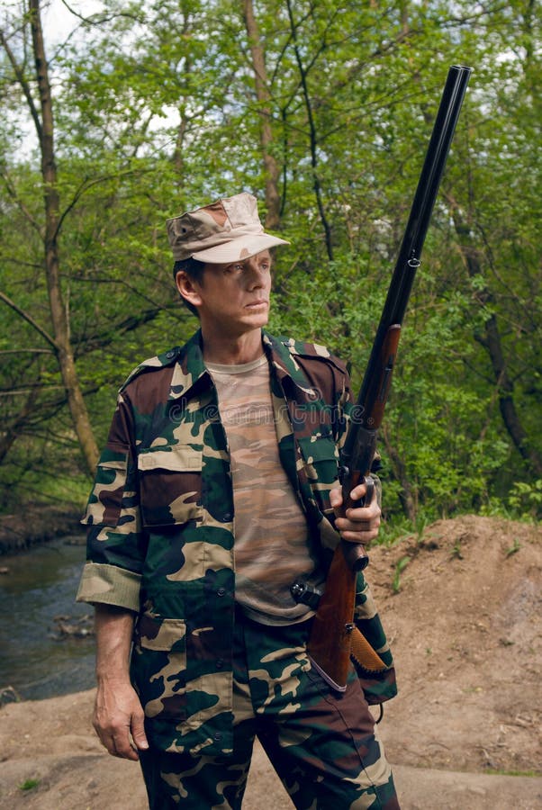 Hunter with gun in hand stock photo. Image of hunter - 14731904
