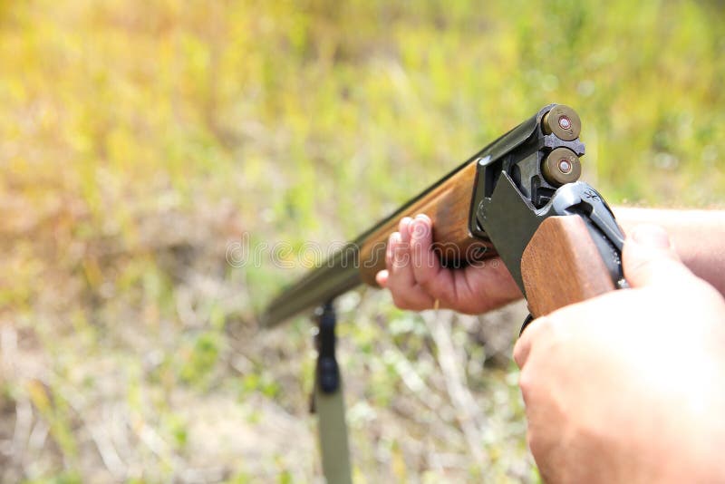 Hunter Holding a Gun Close Up. Stock Photo - Image of holding, mans ...