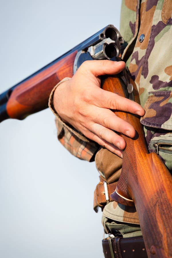 Hunter holding a rifle stock photo. Image of bird, rifle - 53987862