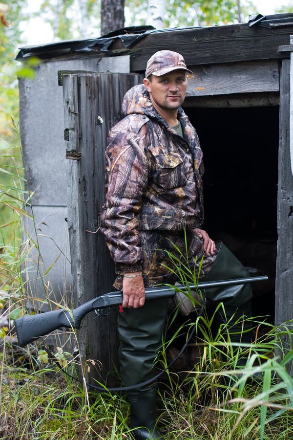Hunter at the hut stock photo. Image of horizontal, house - 45307722
