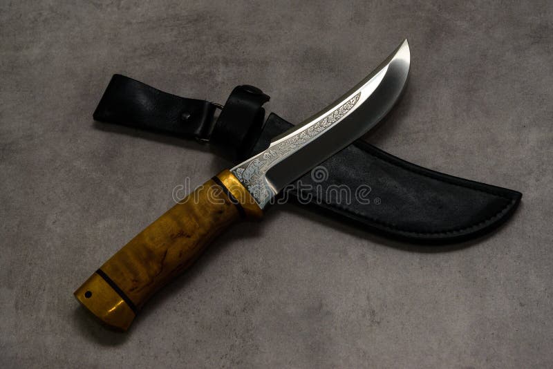 Hunter Knife with Wooden Handle and Patterned Blade Stock Image - Image ...